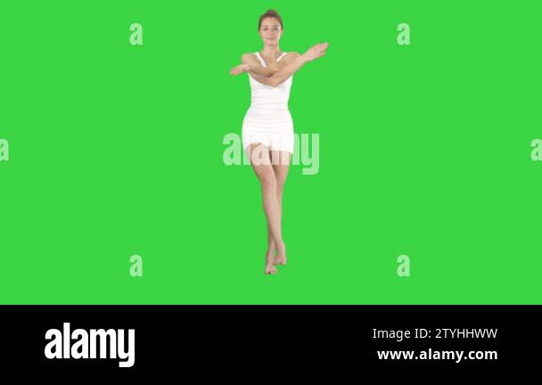 Young woman in the Eagle yoga pose on a Green Screen, Chroma Key Stock ...