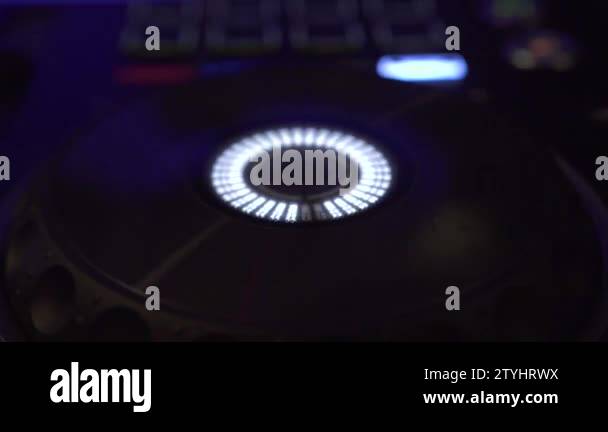 DJ control sound console for mixing house music in nightclub. DJ mixer ...