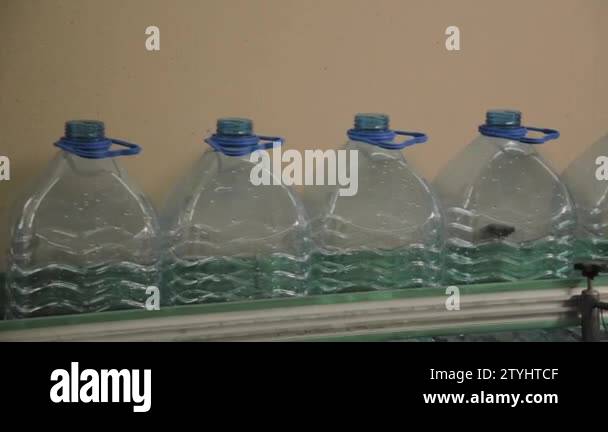 Plastic bottle manufacturing line. Plastic molding bottling factory ...