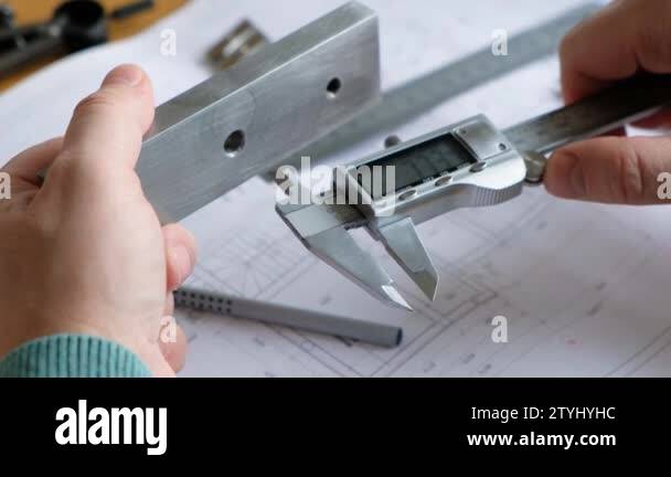 Engineers desk: drawings, beam compasses, ruler and other drawing tools ...