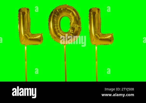 Word lol from helium golden balloon letters floating on green screen ...
