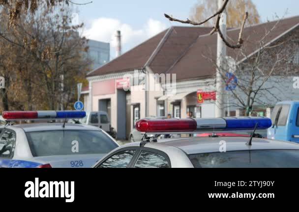 Two Police cars with emergency vehicle lighting during traffic ...