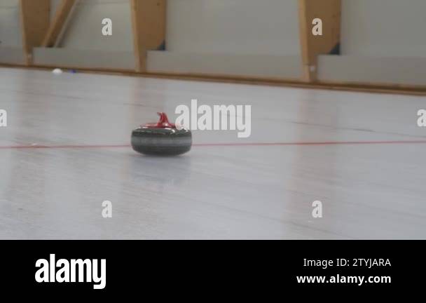 Curling match. Curlers are playing curling game on ice rink. Granite ...