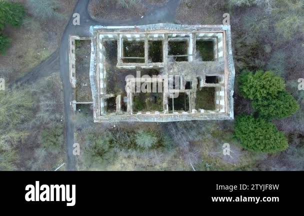 Slow descending to abandoned mansion ruins. Top down drone view with ...