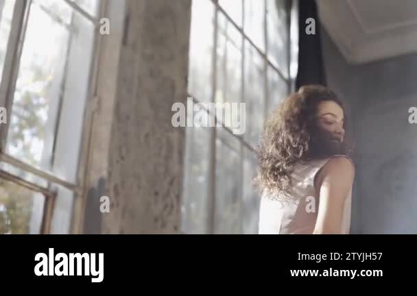 Woman with long hair dancing modern dance. Contemporary freestyle ...