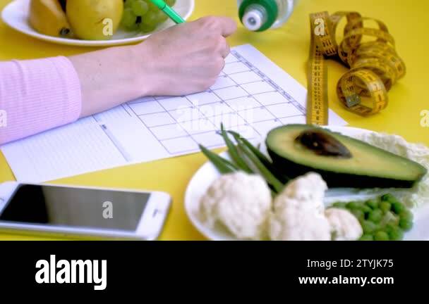 Keeping a fitness calendar.concept of healthy food, diet, top view ...