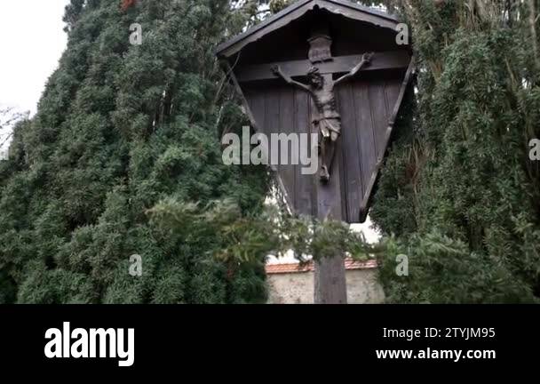 Wooden landmark with Christ crucified on cross. Art. View of wooden ...
