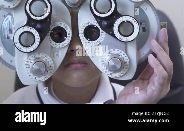Little boys eye examination at optometrist ophthalmologist using ...