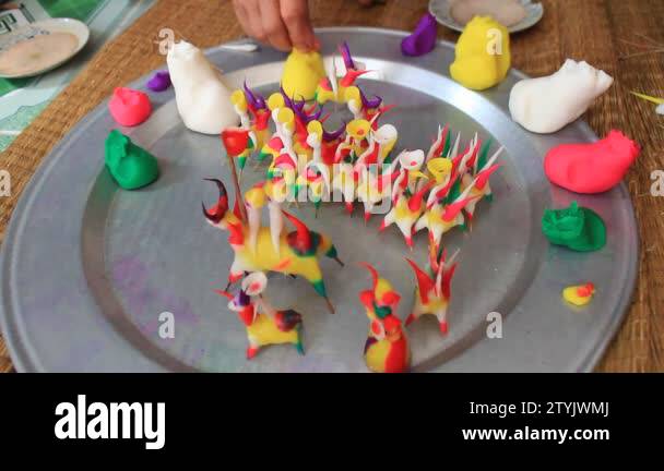 Tohe, the traditional toys in Vietnam made by colored rice powder Stock ...