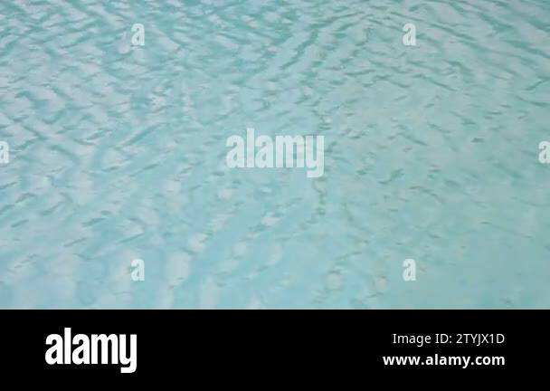 Water surface texture, Slow motion looping clean swimming pool ripples ...