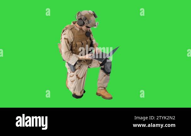 Soldier using laptop and Radio For Communication During Military ...