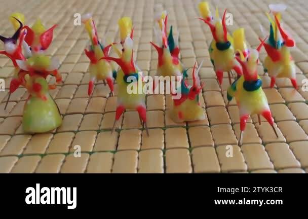 Tohe, the traditional toys in Vietnam made by colored rice powder Stock ...