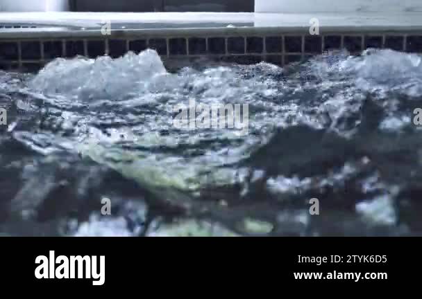 Splashing water in jacuzzi pool on spa center. Boiling water in jacuzzi ...