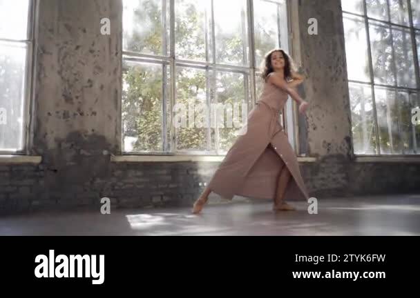 Woman with long hair dancing modern dance. Contemporary freestyle ...