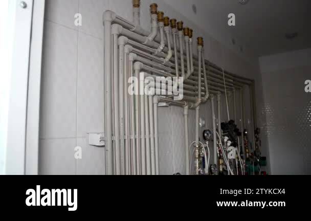 Parallel wiring of plastic pipes for water in an apartment building ...