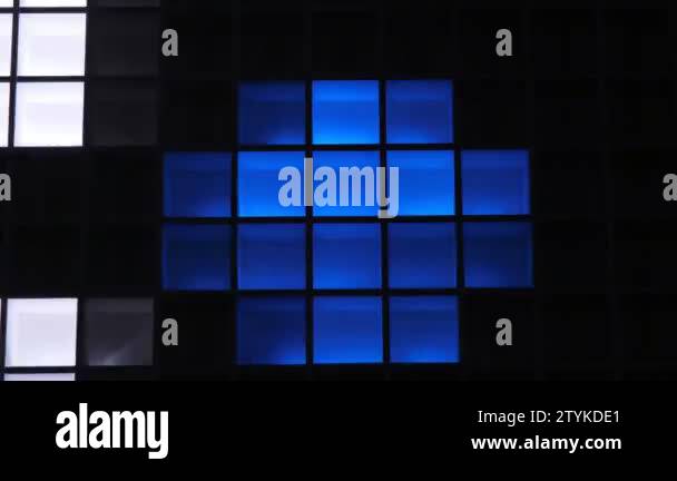 Shimmering squares as a part of the light music screen in a club in ...