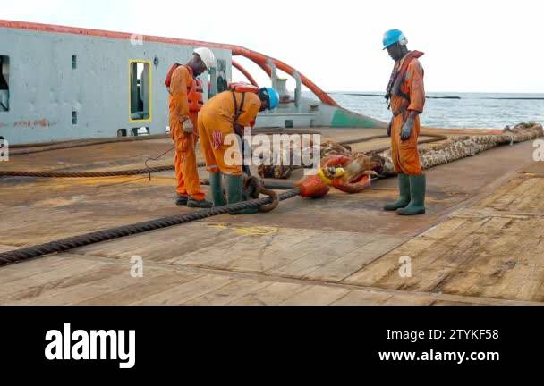 Anchor-handling Tug Supply AHTS vessel crew preparing vessel Stock Video Footage - Alamy