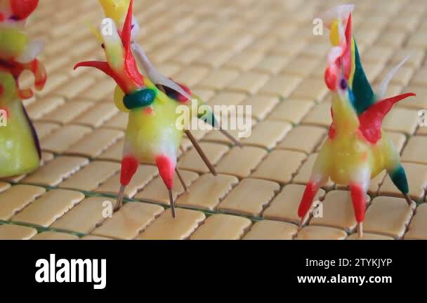 Tohe, the traditional toys in Vietnam made by colored rice powder Stock ...