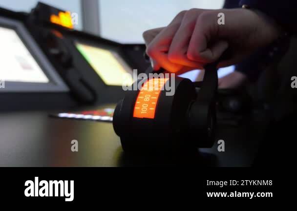 Navy officer pulling the handle of a semi-round route device in a ...