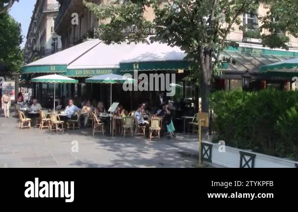 People sitting outside at a paris cafe restaurant Stock Videos ...