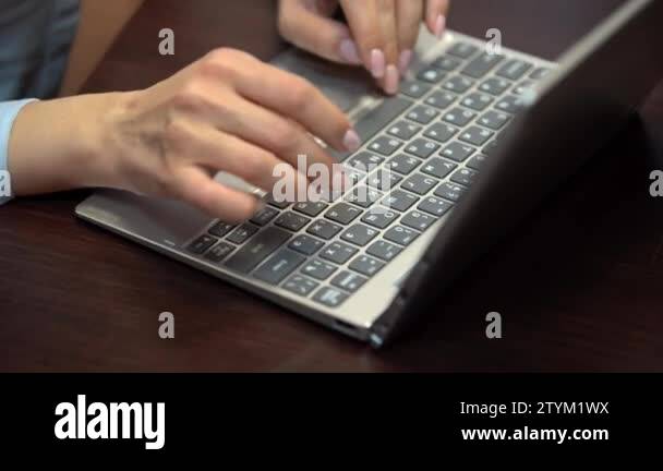 Woman / office worker / Secretary presses keyboard keys, typing, close ...