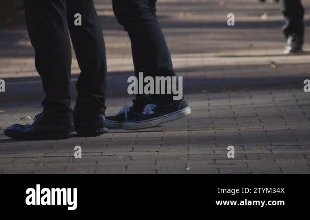 Walking people body parts at the street in the business town in ...