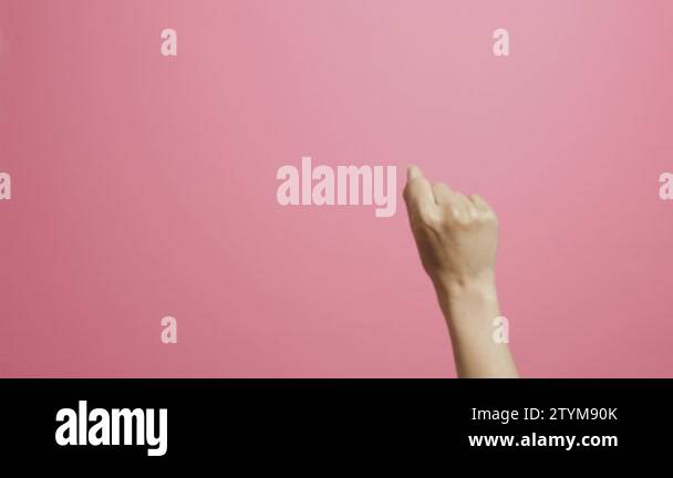 female hand count from one to five on a pink color studio background ...