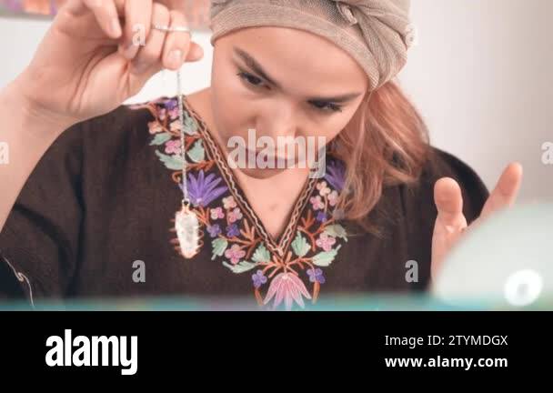 Beautiful mixed race mystic woman with divine magic powers chanting ...