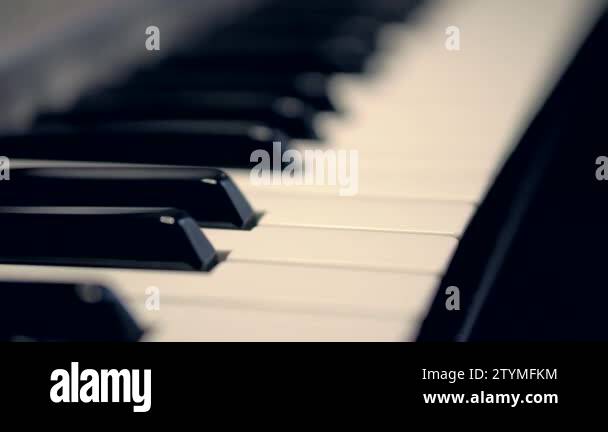 Synthesizer Keyboard. Fingers close on piano keys. Men's hands play ...