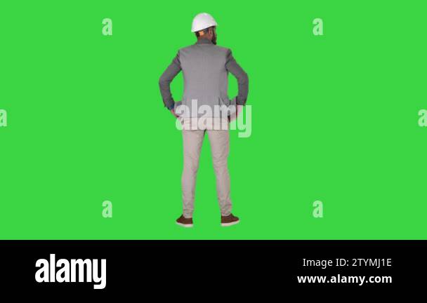 Engineer standing and looking around on a Green Screen, Chroma Key ...