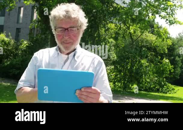 Old man tablet pc Stock Videos & Footage - HD and 4K Video Clips - Alamy