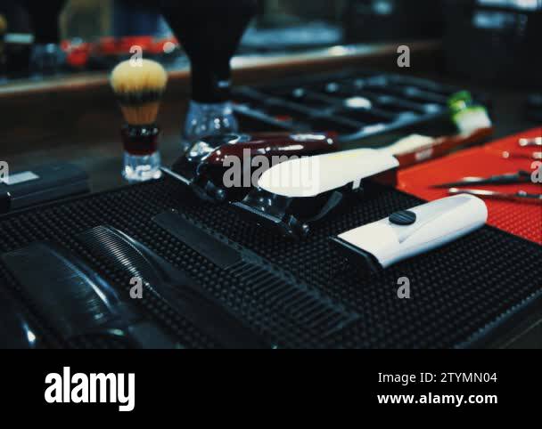 Professional barber electirc shaving machines.Shave clients beard and ...