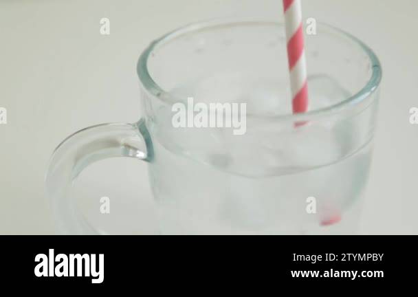 Step-by-step preparation of cocktails in glass. Adding carbonated water ...