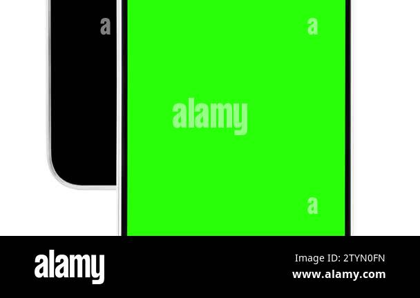 Footage of modern no name white smart phone device with green chroma ...