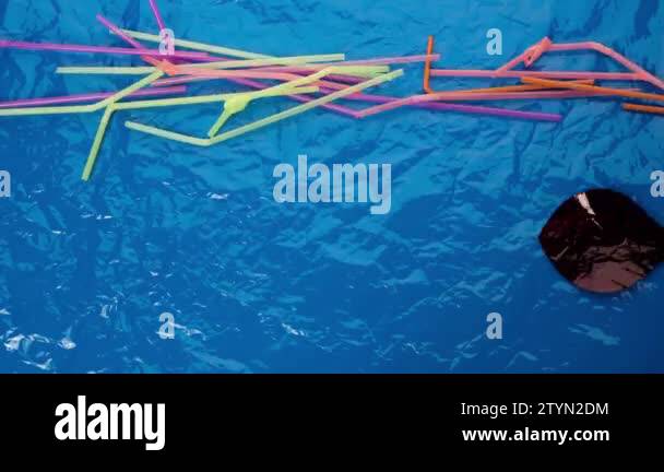 Plastic in the ocean. Animation with drinking straws and fish under ...