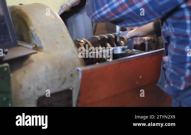 Overhaul of a car engine. Boring the crankshaft of an internal ...