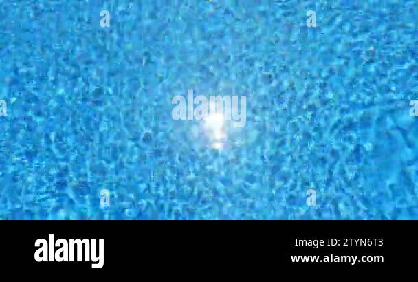water ripples and sun hightlight in swimming pool, blue background, 4k ...