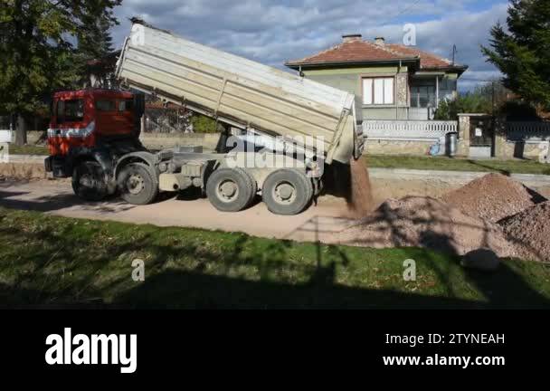 Large construction truck delivering stone for road asphalting Stock ...