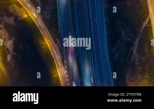 Hyperlapse ascending view from the heights of traffic in a roundabout ...