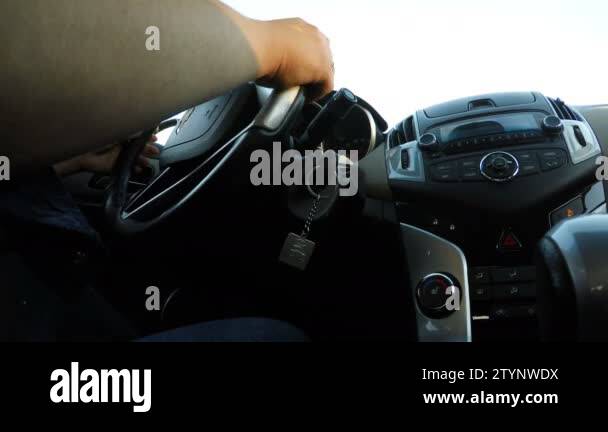 The driver is stirring the wheel of the car, when the vehicle is ...