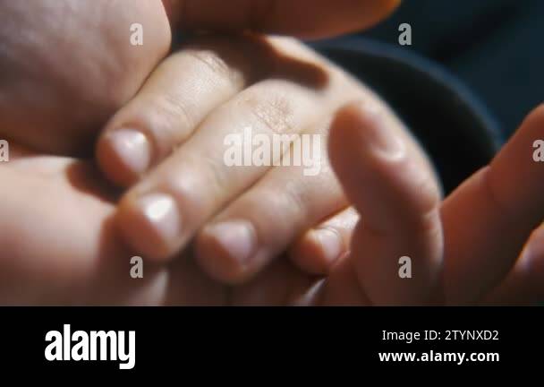 Friendly brothers`hands shaking and caressing each other inside of a ...