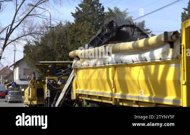 Roadworks - Unloading Powdered Asphalt into the Truck - Slow Motion ...
