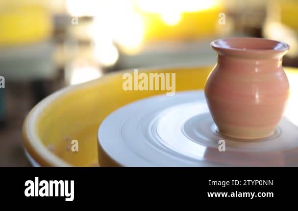 Handcraft Pottery inside. clay vase turning on pottery wheel, potters ...