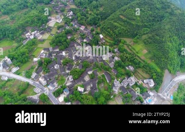 Aerial view, green rice and vegetable fields in poor village in China ...