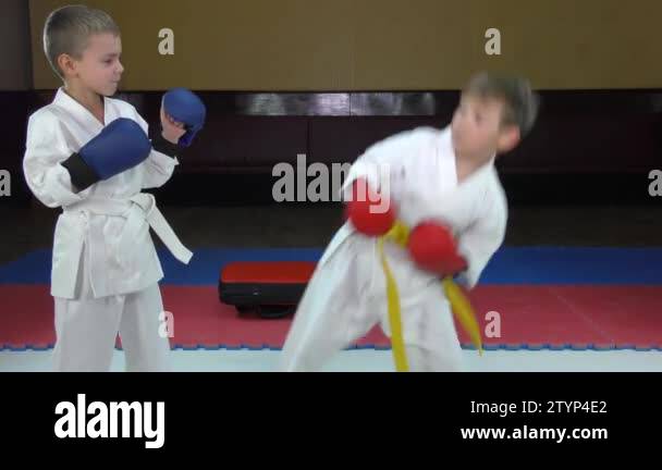 Children with red and blue overlays on their hands train stance ...