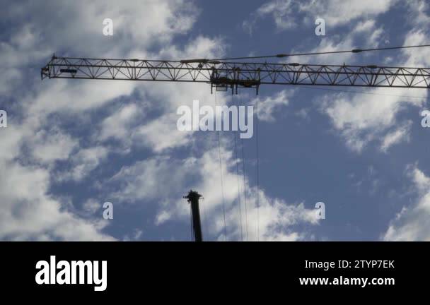 The lifting mechanism of the tower crane moves along the boom Stock ...