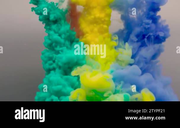 Ink in water isolated on white background. Rainbow of colors. Acrylic ...
