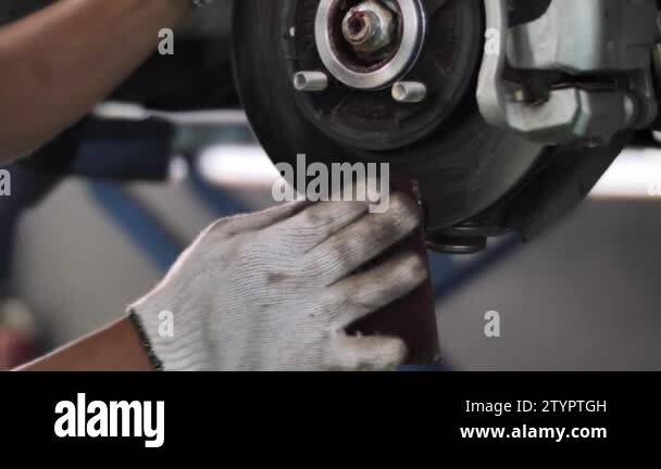 Car auto service maintenance brake system, brake disk of the car on the ...