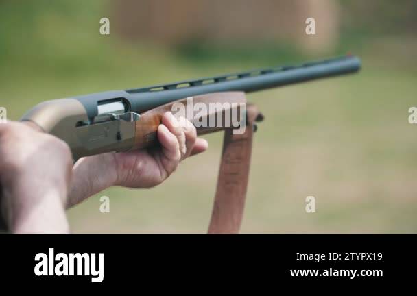 Hunting rifle firing and a cartridge case flying out breaching lock in ...