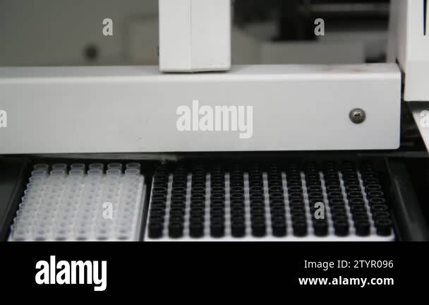 Computerized medical equipment for blood analysis going like a robot ...